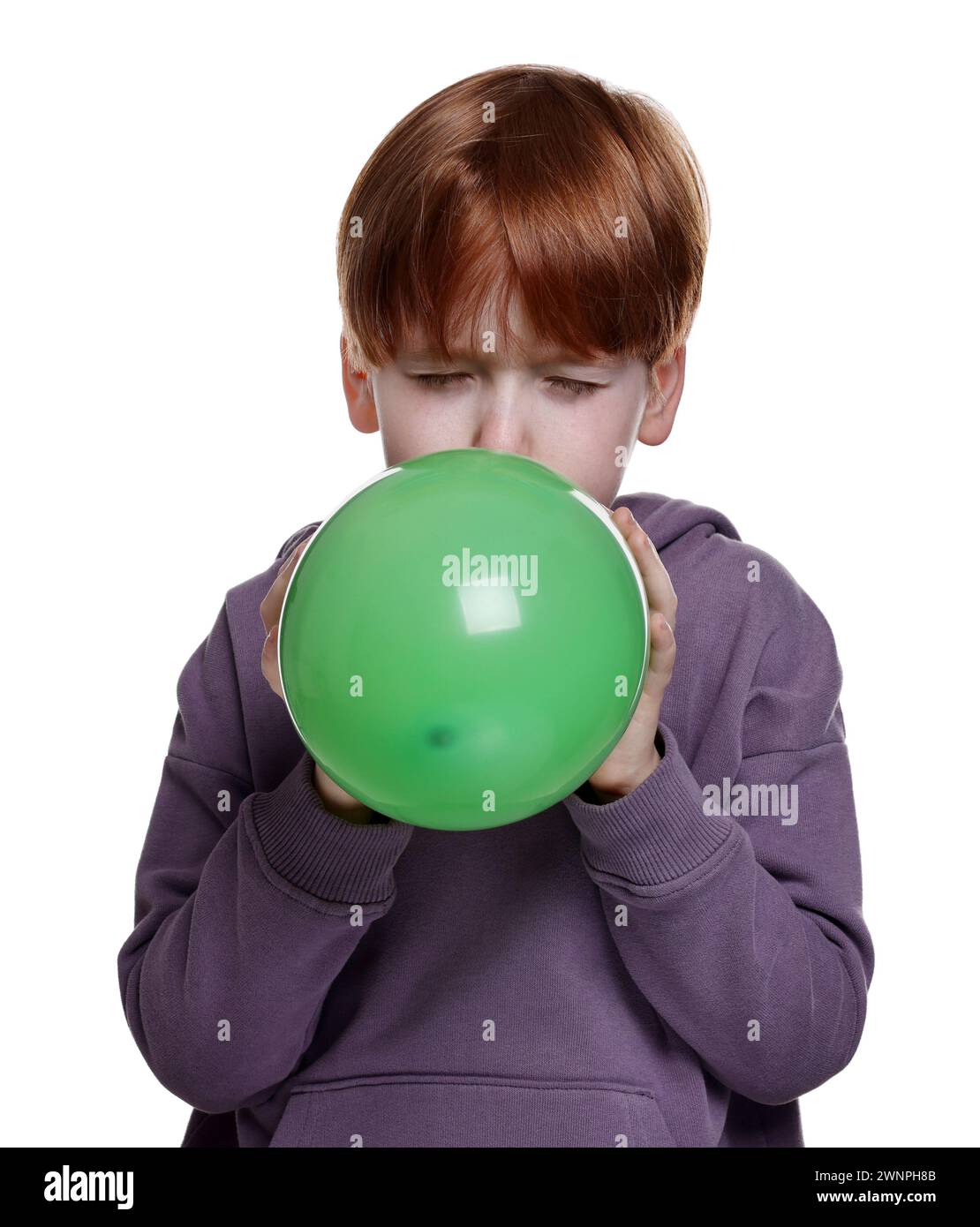 Boy inflating green balloon on white background Stock Photo - Alamy