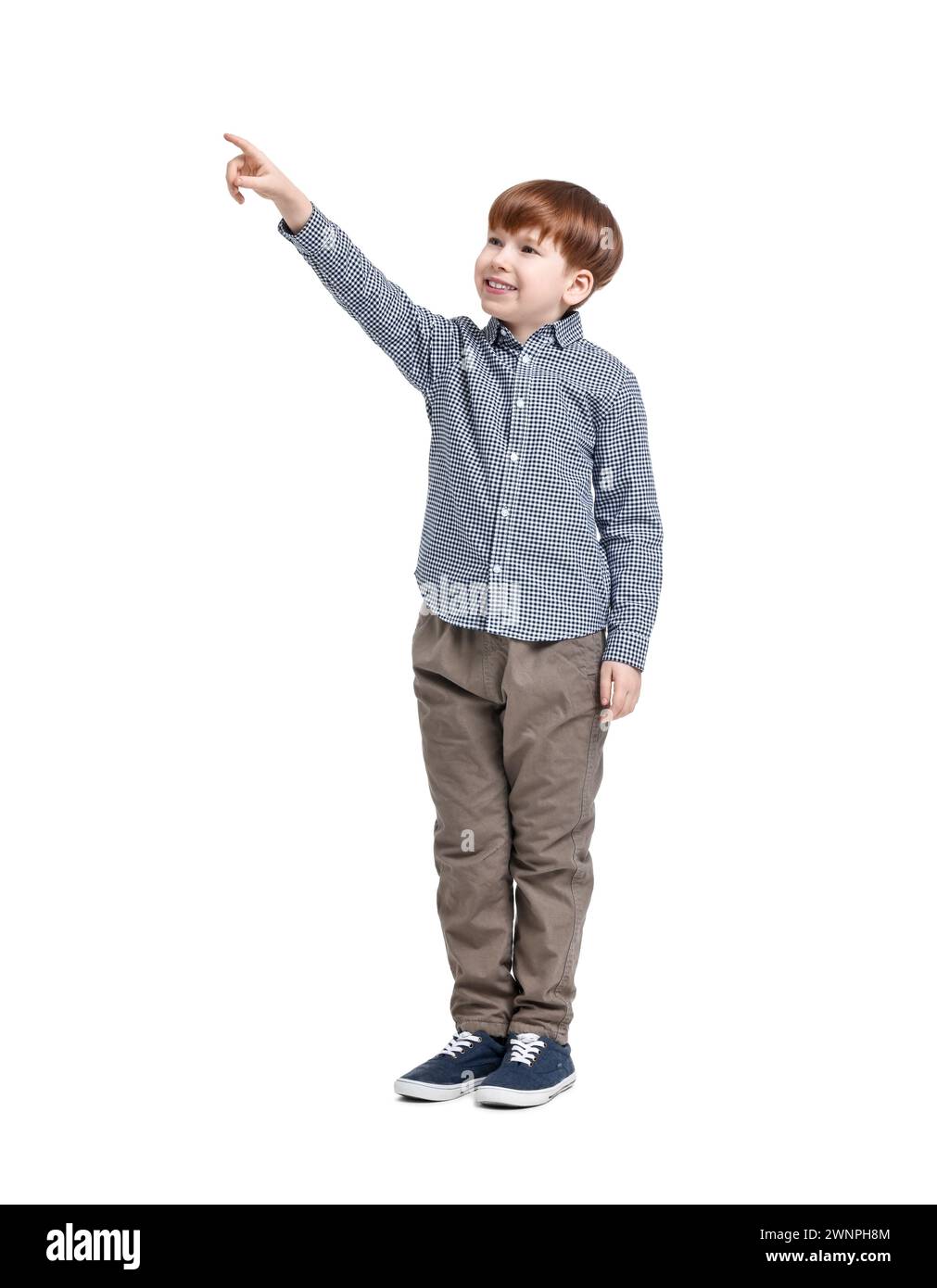 Little boy pointing at something on white background Stock Photo - Alamy