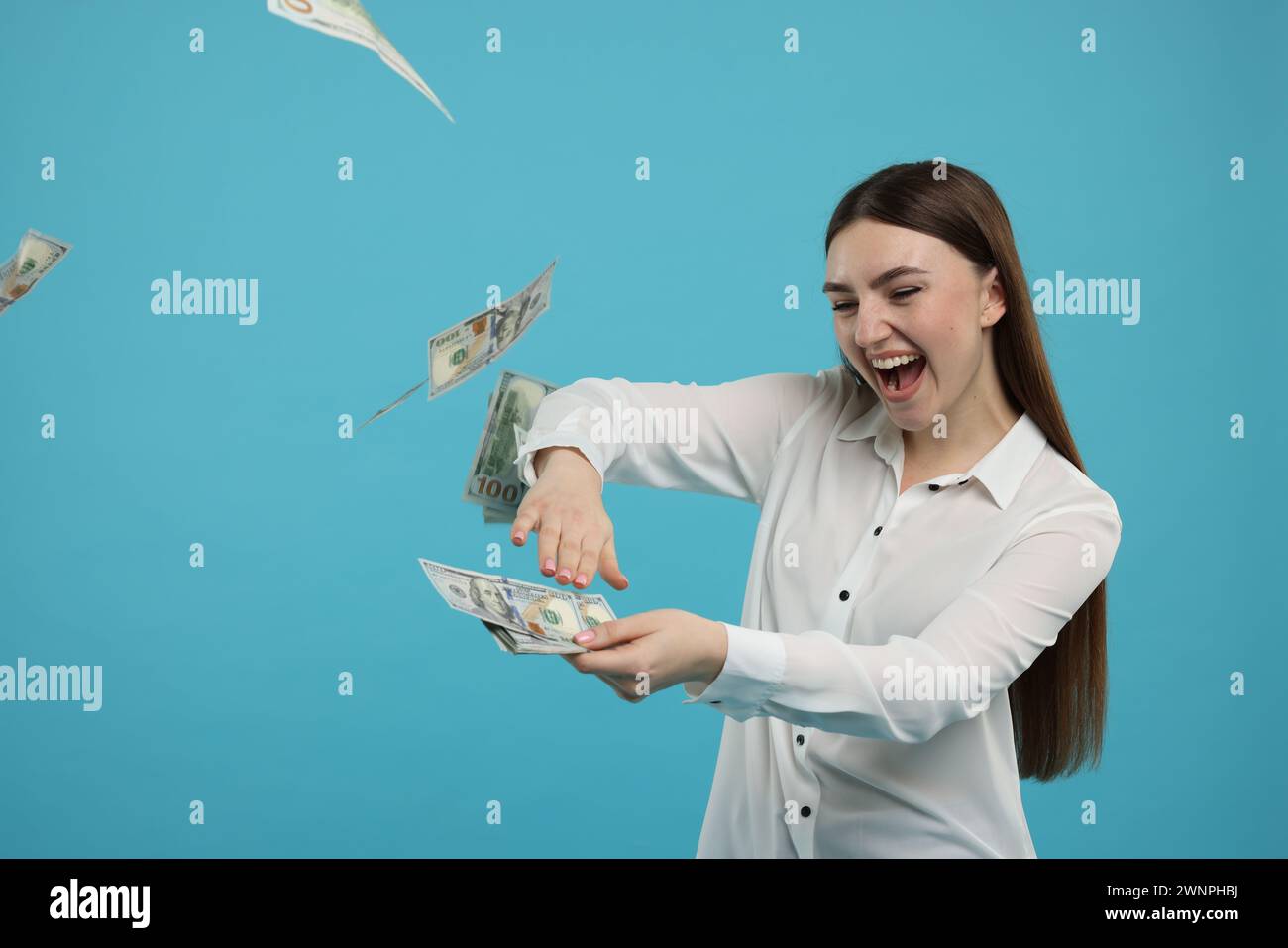 Young female lottery winner throwing hi-res stock photography and ...