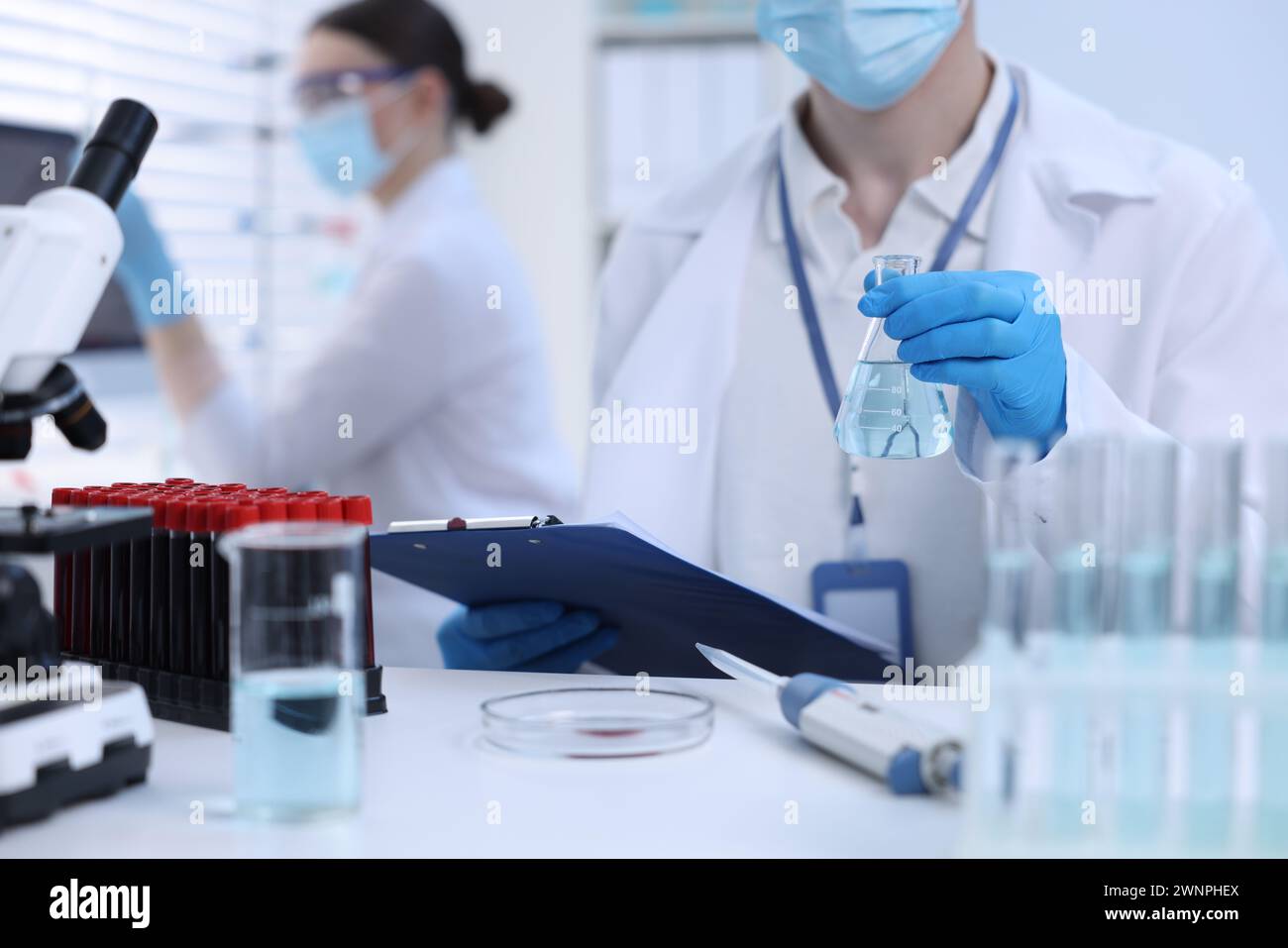 Scientists working with samples in laboratory, closeup. Medical ...