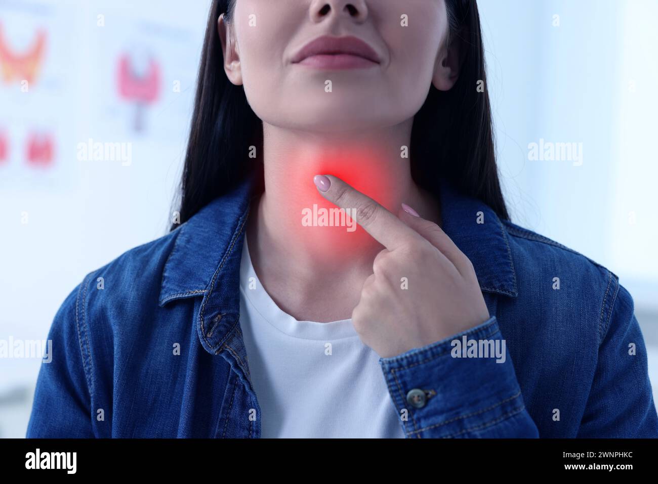 Endocrine system. Woman doing thyroid self examination indoors, closeup ...