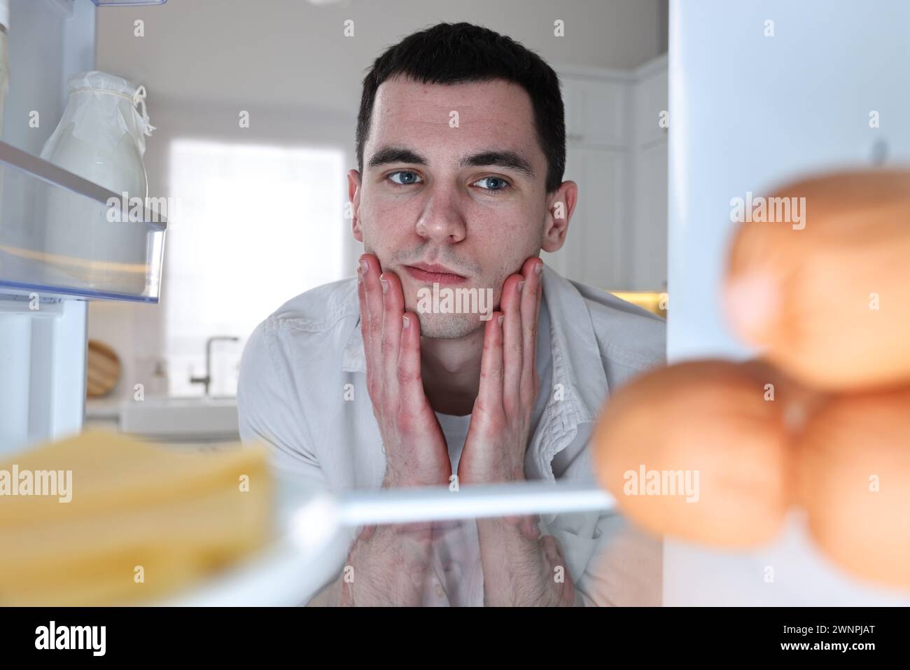 View from inside fridge man hi-res stock photography and images - Alamy