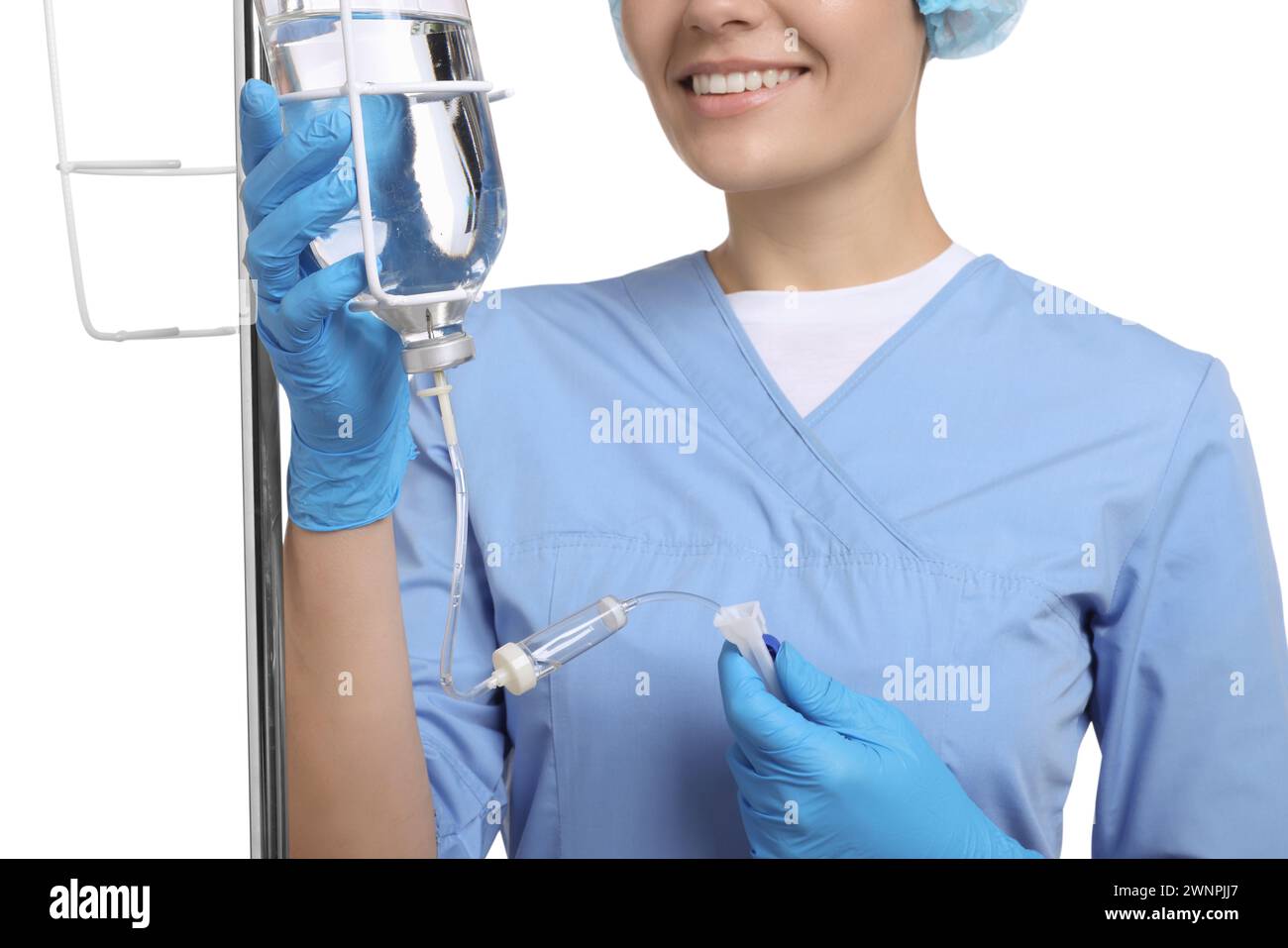 Nurse setting up IV drip on white background, closeup Stock Photo - Alamy