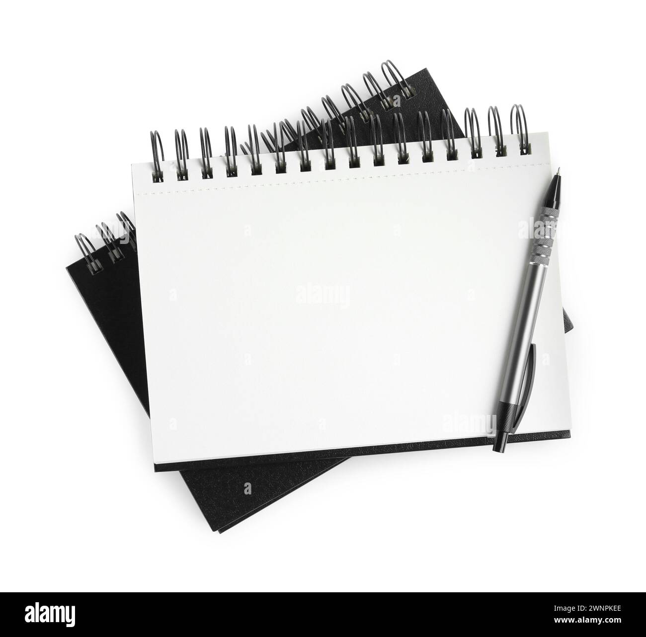 Two notebooks and pen isolated on white, top view Stock Photo - Alamy