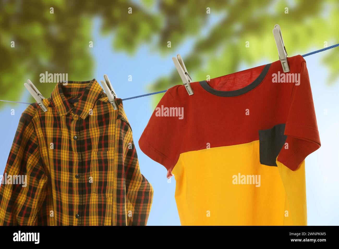 Colorful clothes drying on washing line outdoors Stock Photo - Alamy
