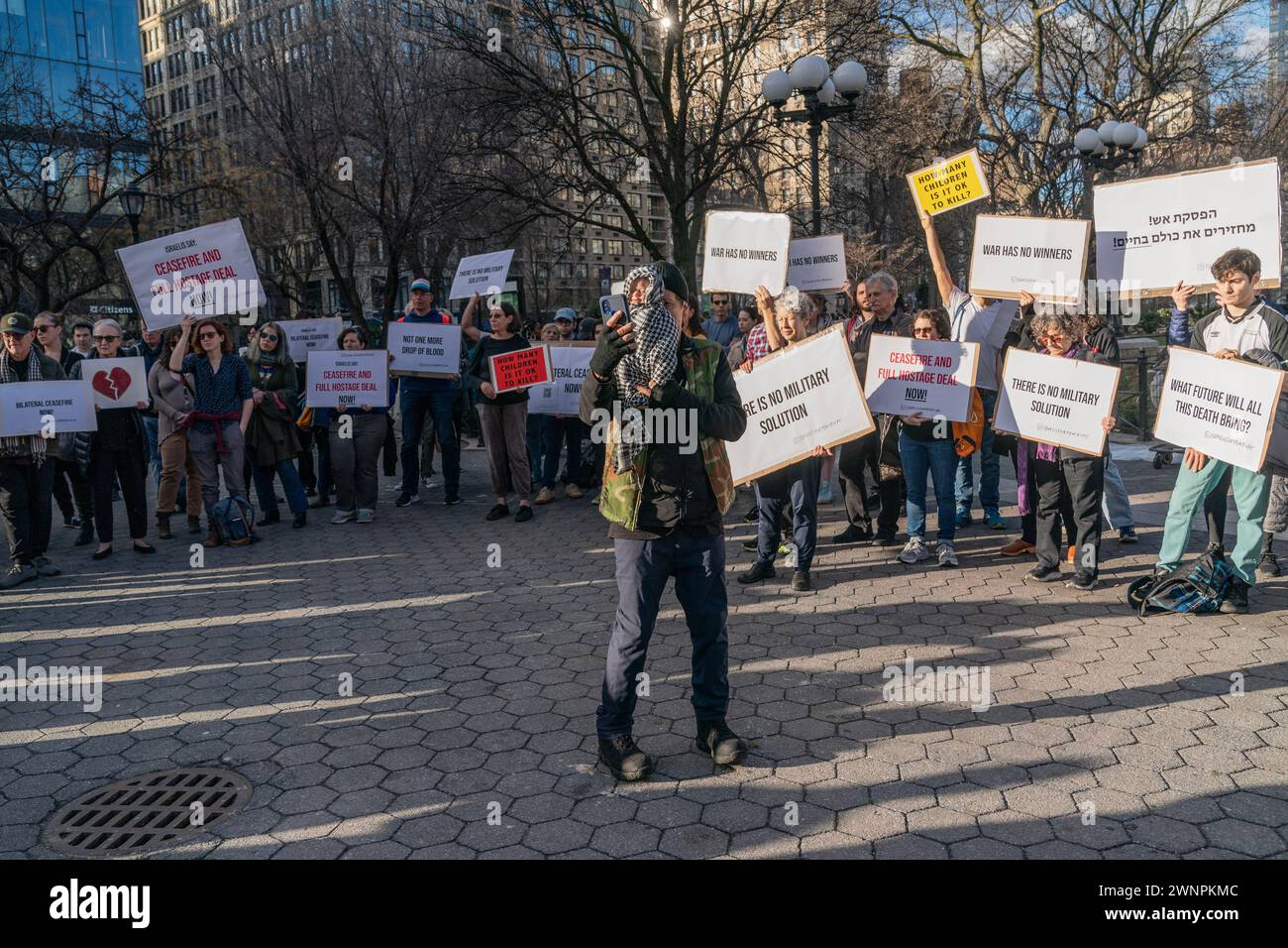 Lone pro-Palestinian activist with doll wrapped in keffiyeh attends ...