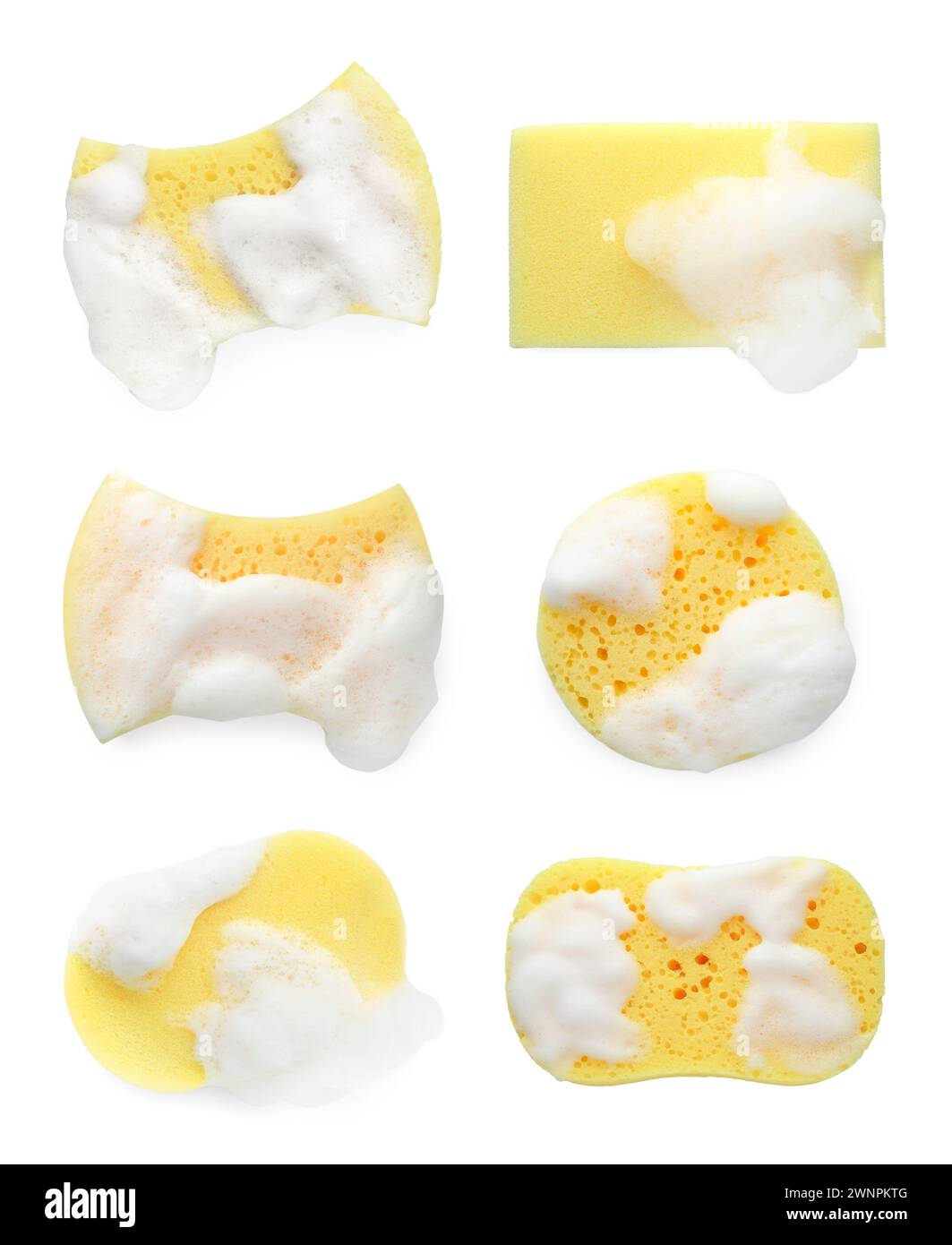 Different yellow sponges with foam isolated on white, top view Stock ...