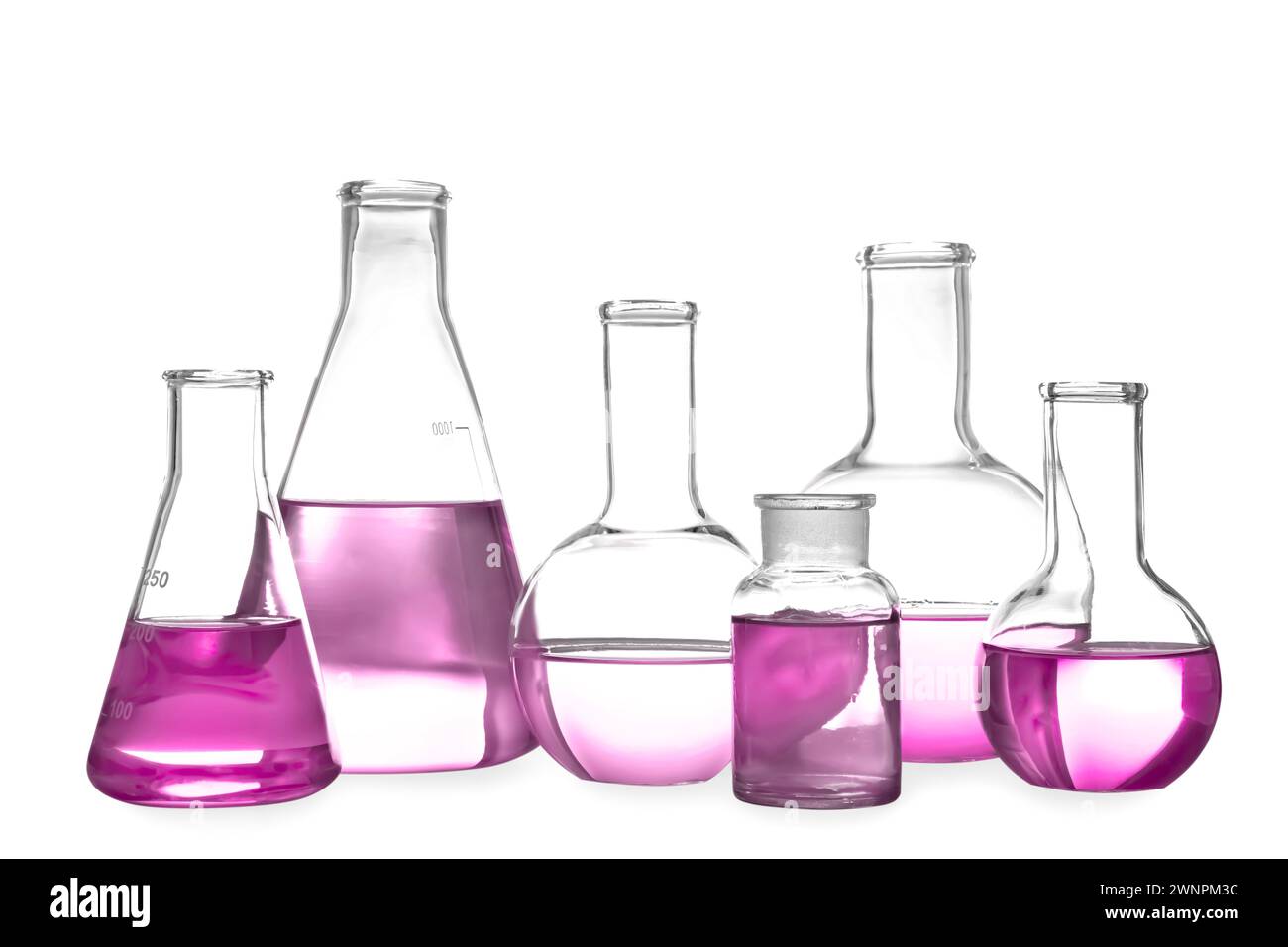 Laboratory glassware with pink liquid isolated on white Stock Photo - Alamy