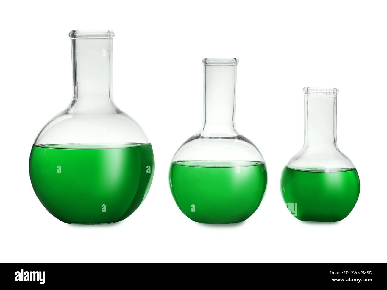 Boiling flasks with green liquid isolated on white. Laboratory ...