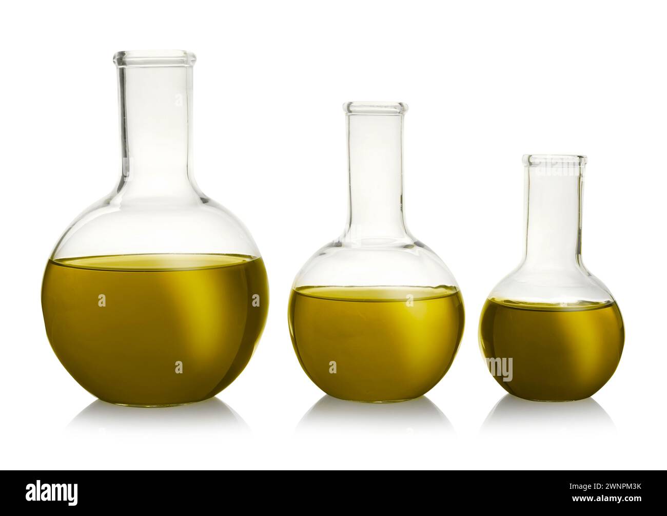 Boiling flasks with yellow liquid isolated on white. Laboratory ...