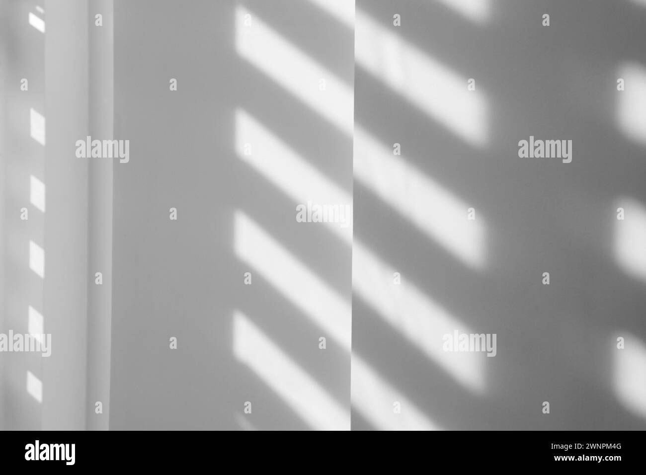 Light and shadows falling on white wall Stock Photo - Alamy