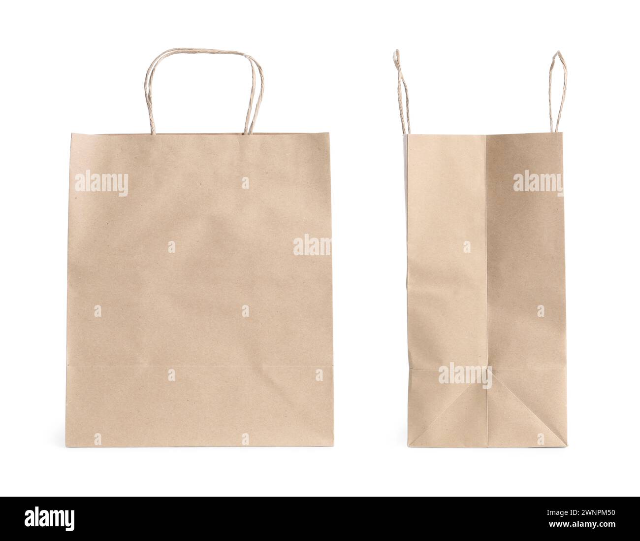 Kraft paper bags with handles isolated on white Stock Photo - Alamy