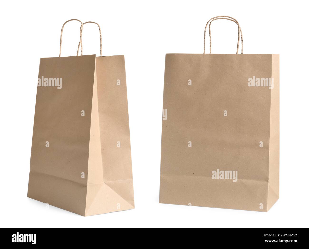 Kraft paper bags with handles isolated on white Stock Photo - Alamy