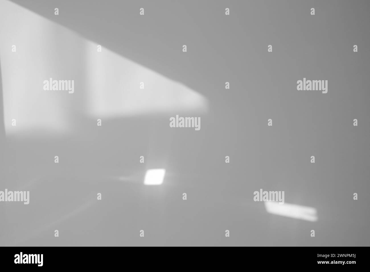 Light and shadows falling on white wall Stock Photo - Alamy