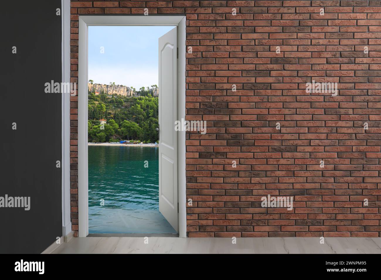 Beautiful sea and green trees visible through open door Stock Photo - Alamy
