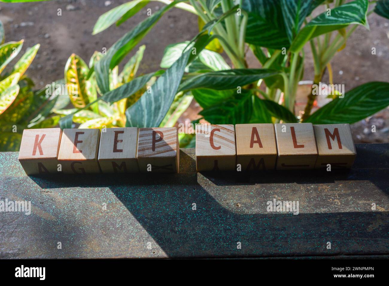 Photo of words with wooden block objects arranged into the word "KEEP ...