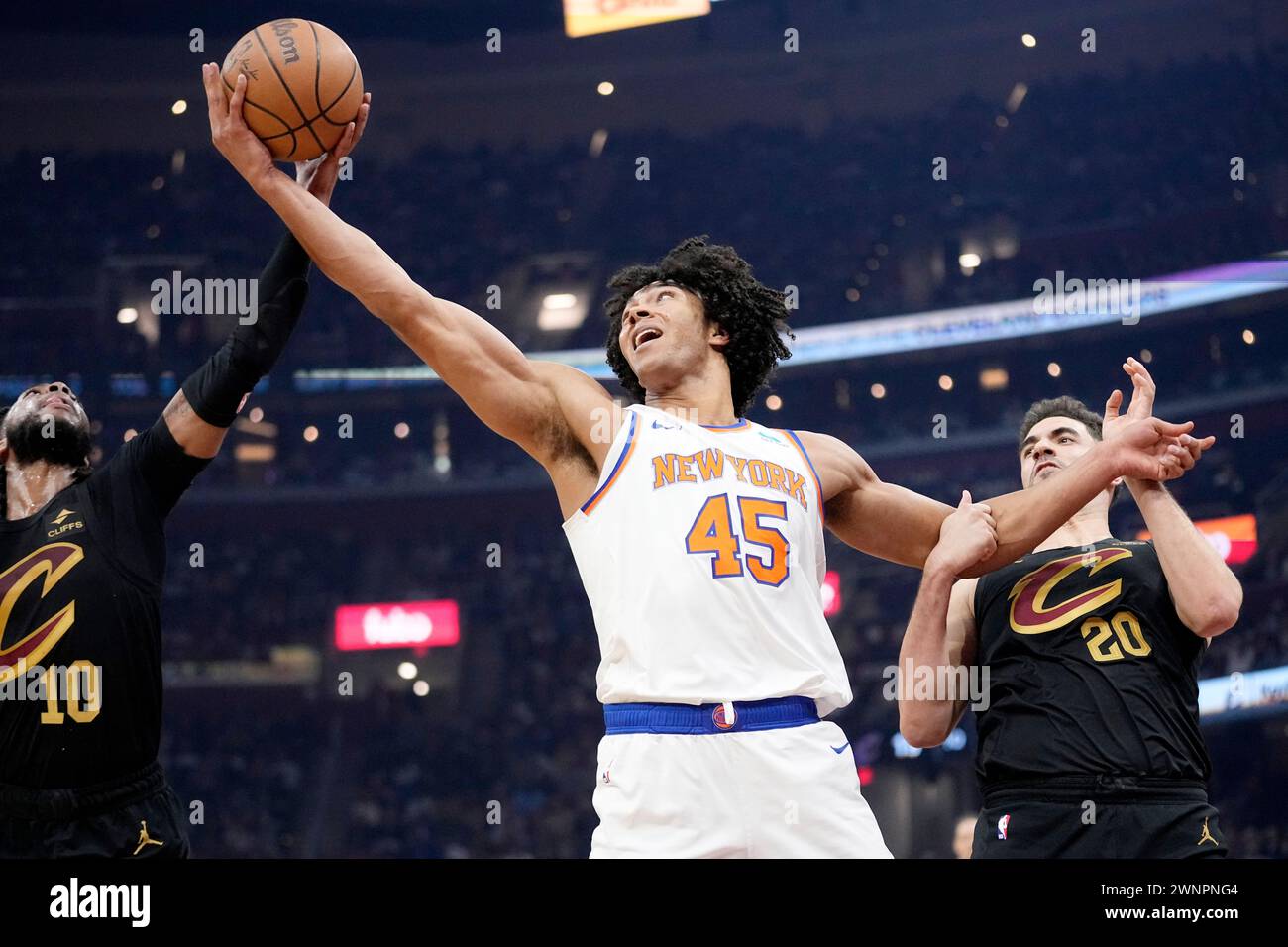 New York Knicks center Jericho Sims (45) reaches for a rebound between ...