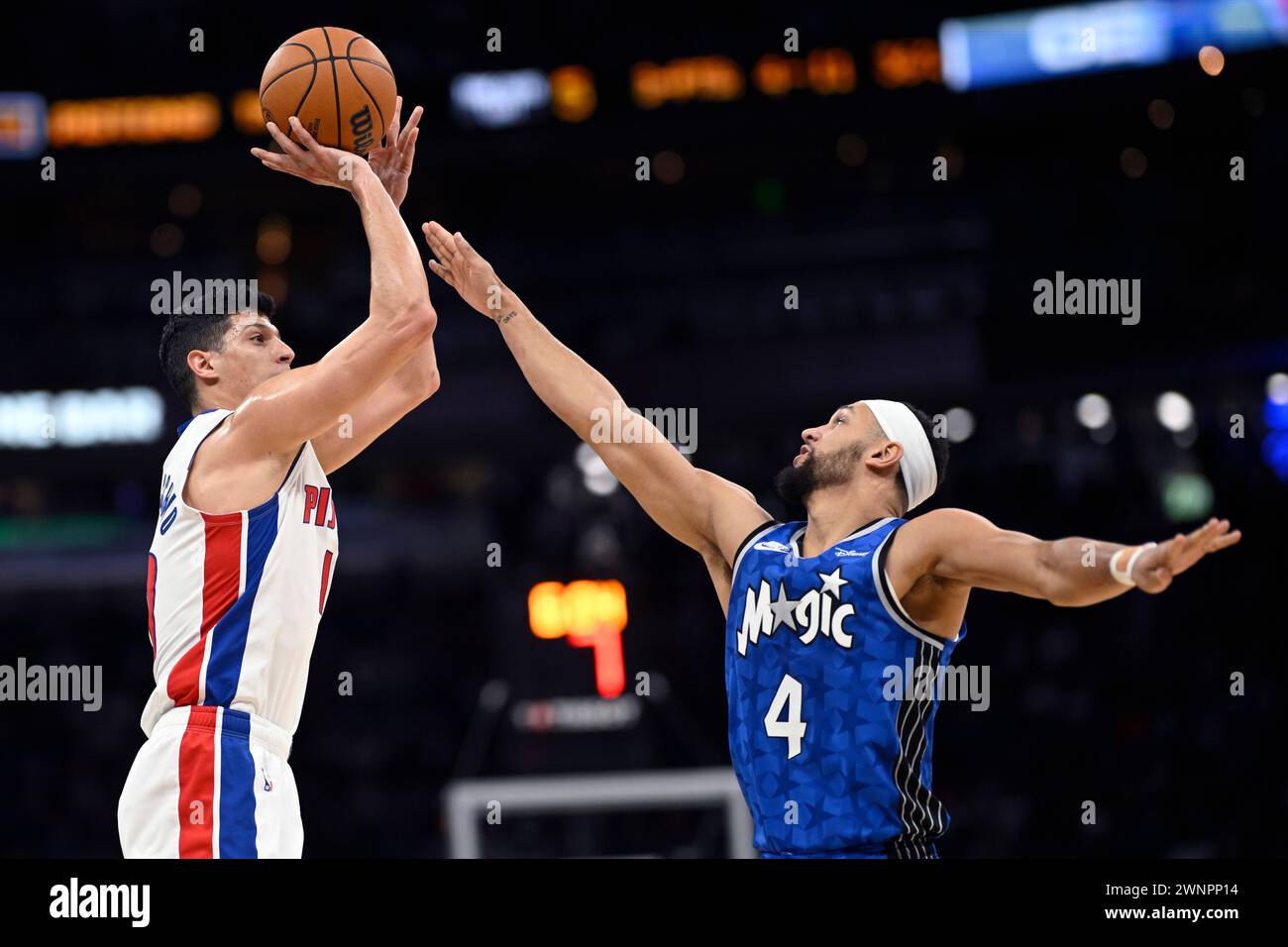 Detroit Pistons forward Simone Fontecchio, left, shoots as Orlando ...