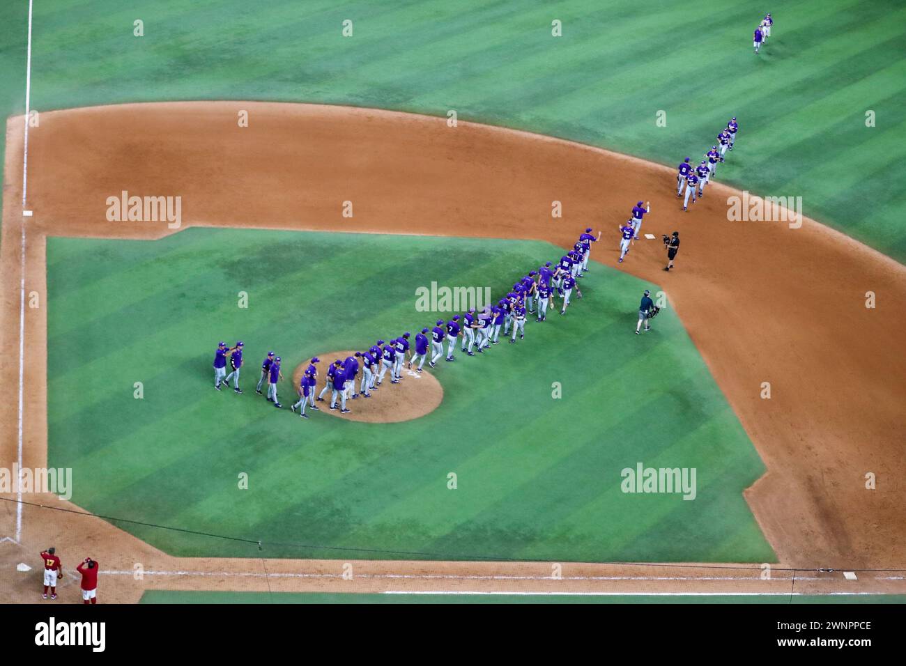 Arlington, Texas, USA. 3rd Mar, 2024. The TCU baseball teams runs and ...