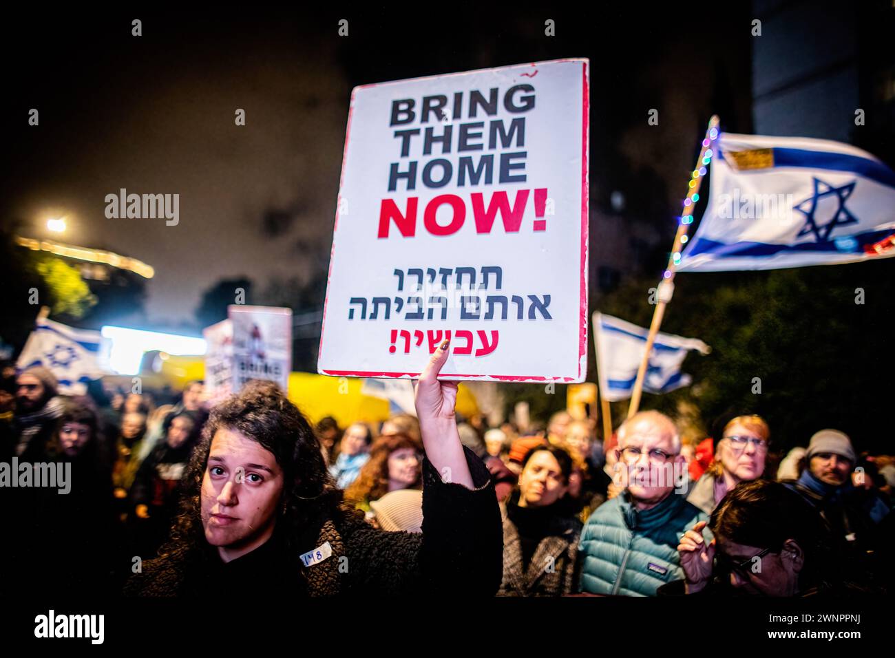 Jerusalem, Israel. 02nd Mar, 2024. A protester holds a placard that ...