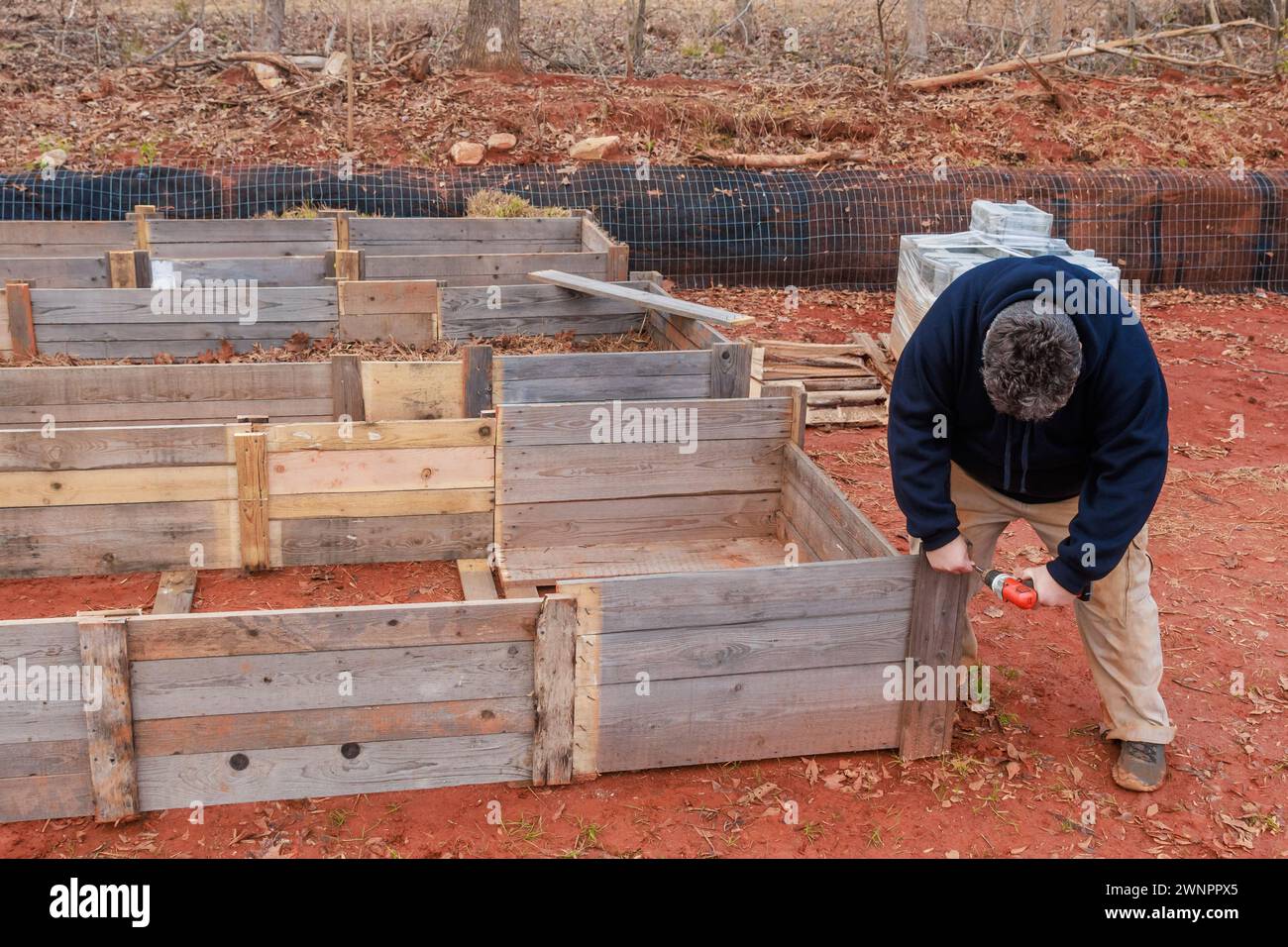 Construction of raised garden bed frame made of wood Stock Photo - Alamy