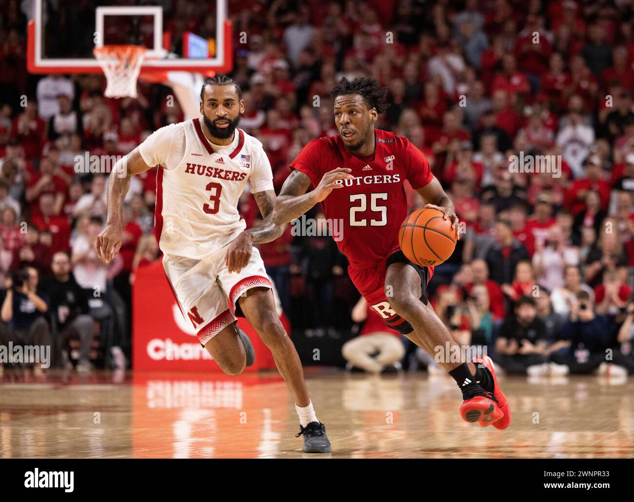 Rutgers' Jeremiah Williams (25) drives downcourt against Nebraska's ...