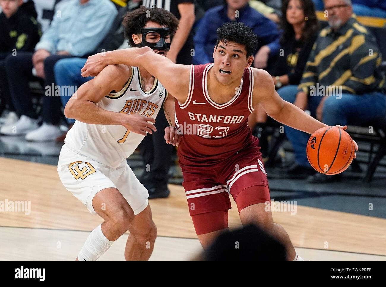 Stanford forward Brandon Angel, right, drives past Colorado guard J ...