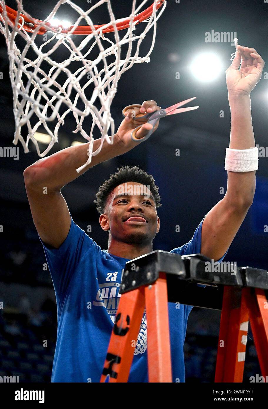 Indiana State's Julian Larry displays his piece of the net afteran NCAA ...