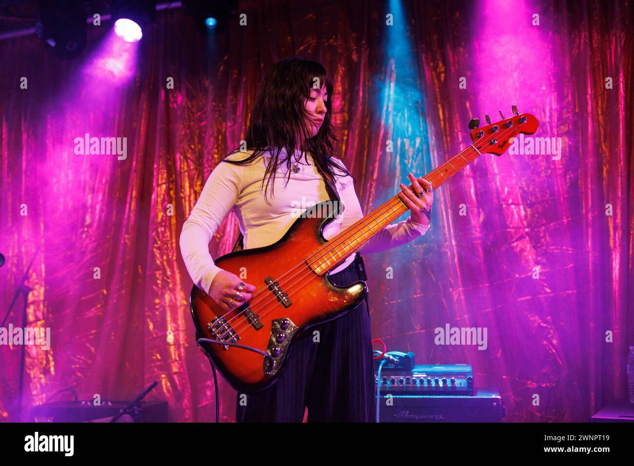 Tippi Morgan, model and bass guitarist of of Lime Garden, performing ...