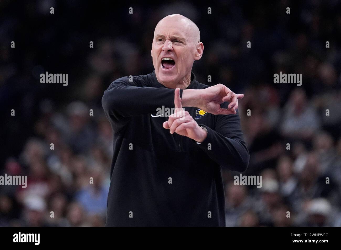 Indiana Pacers head coach Rick Carlisle signals to his players during ...