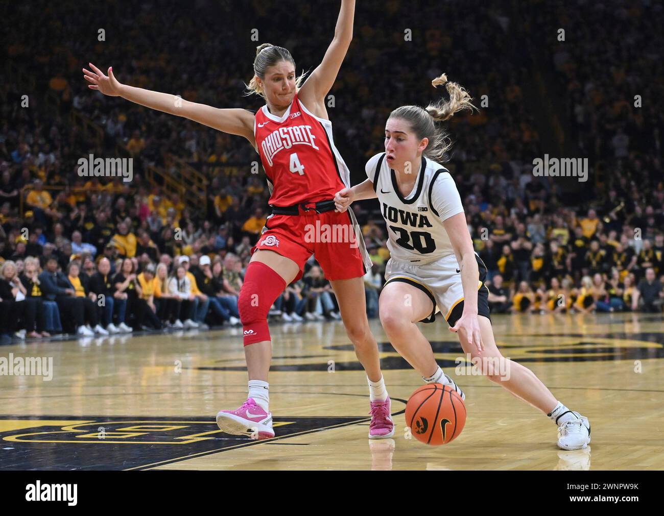 IOWA CITY, IA - MARCH 03: Iowa guard Kate Martin (20) drives to the ...