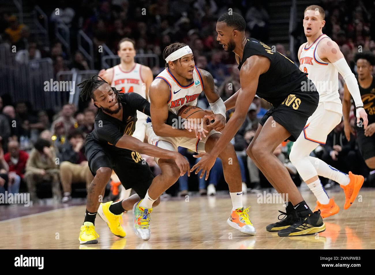 Cleveland Cavaliers guard Darius Garland (10) left, and forward Evan ...