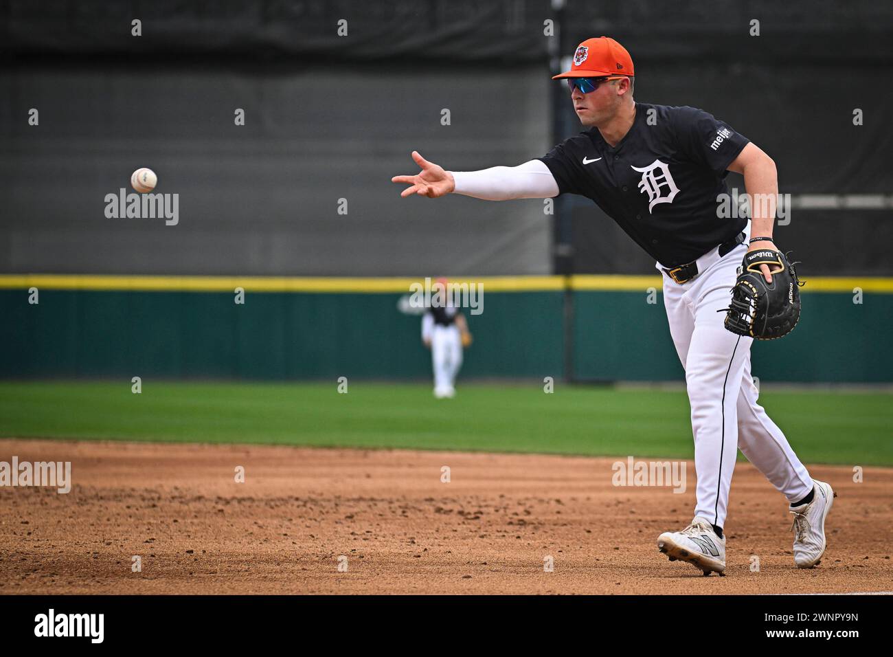 Detroit Tigers left fielder Mark Canha (21) fields during a MLB spring ...