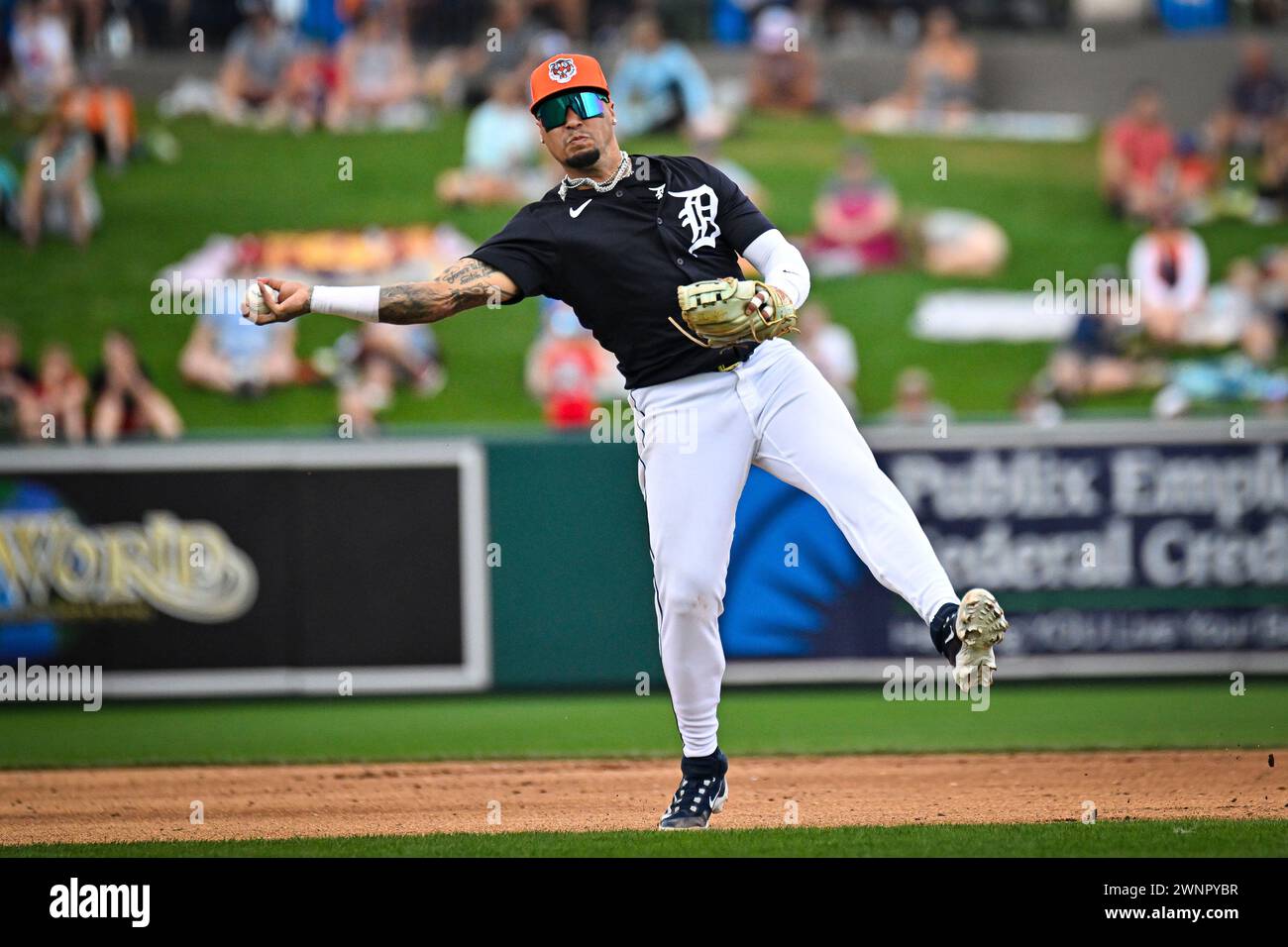 Detroit Tigers shortstop Javier Baez (28) throws to first base against ...