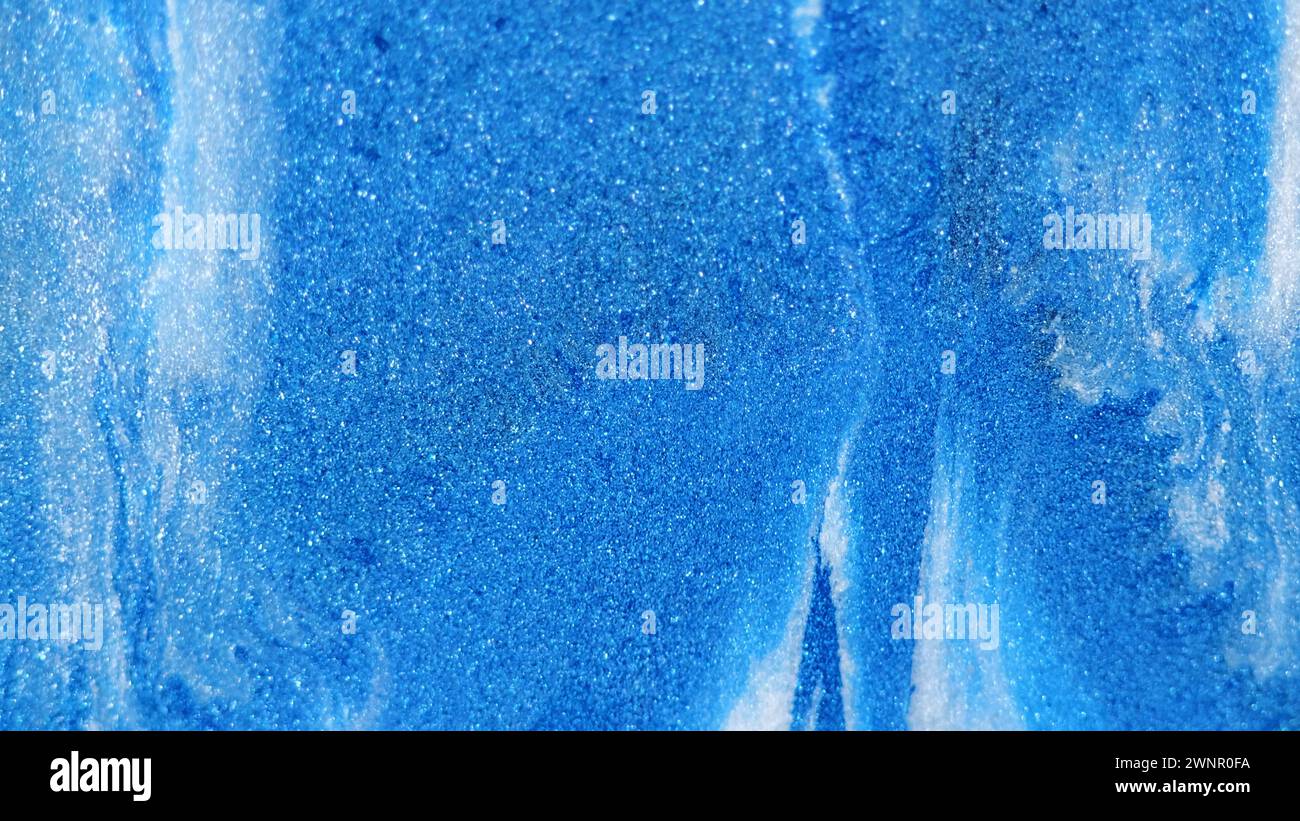 Glitter texture shiny particles blue white paint Stock Photo - Alamy
