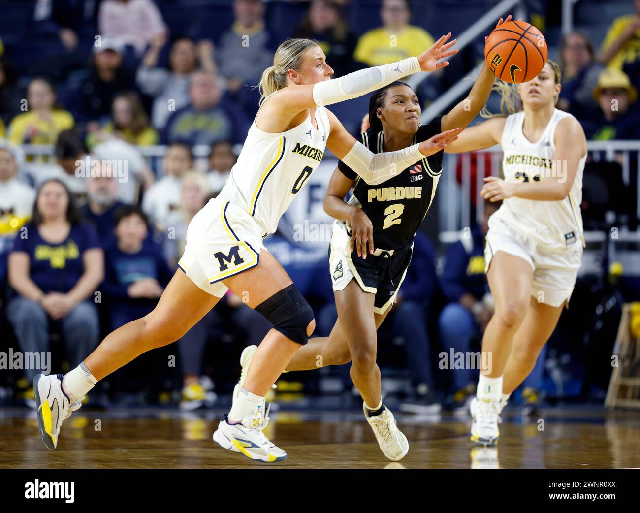 Michigan guard Elissa Brett (0), left, and Purdue guard Rashunda Jones ...