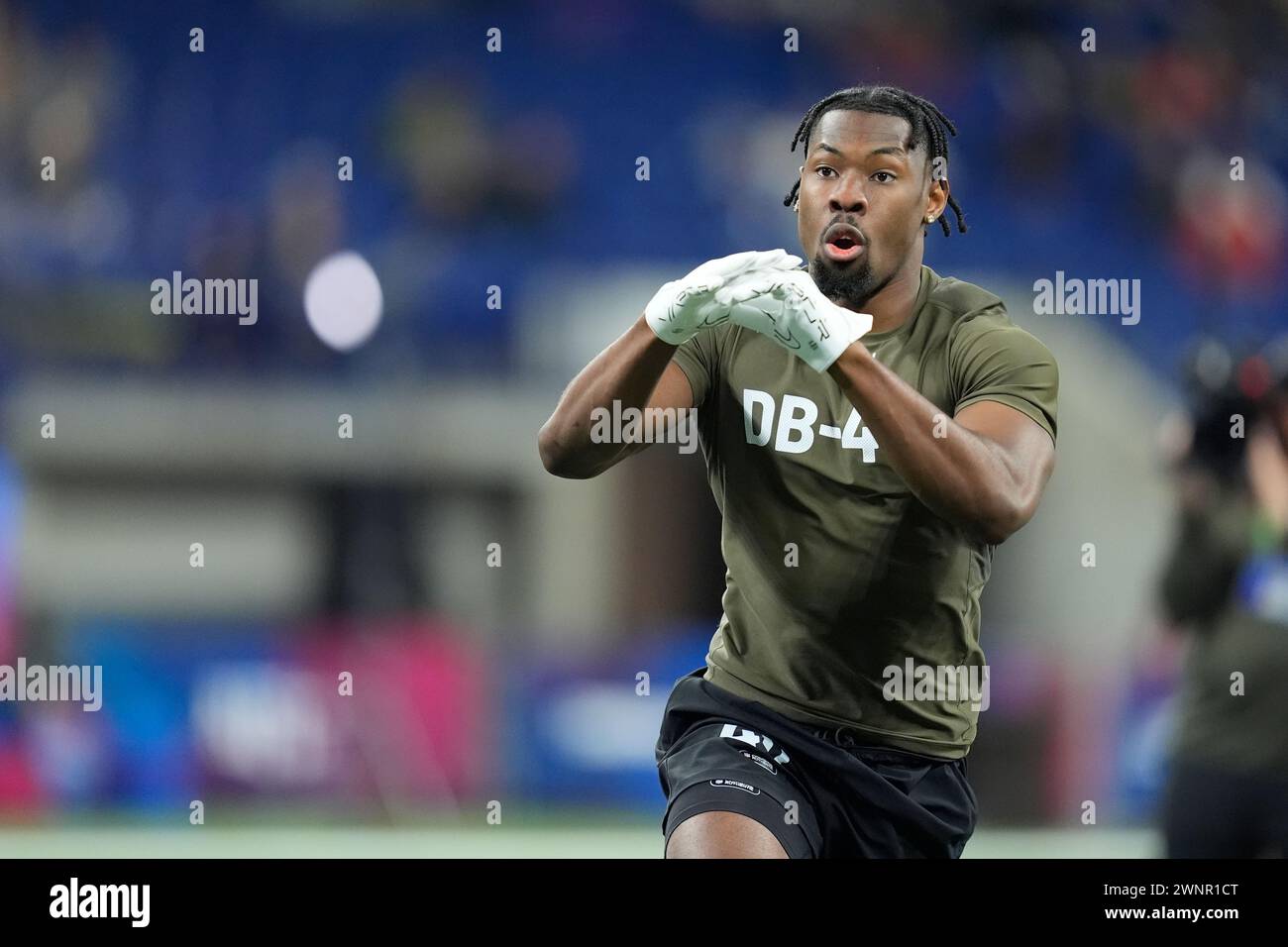 Michigan defensive back Josh Wallace runs a drill at the NFL football ...