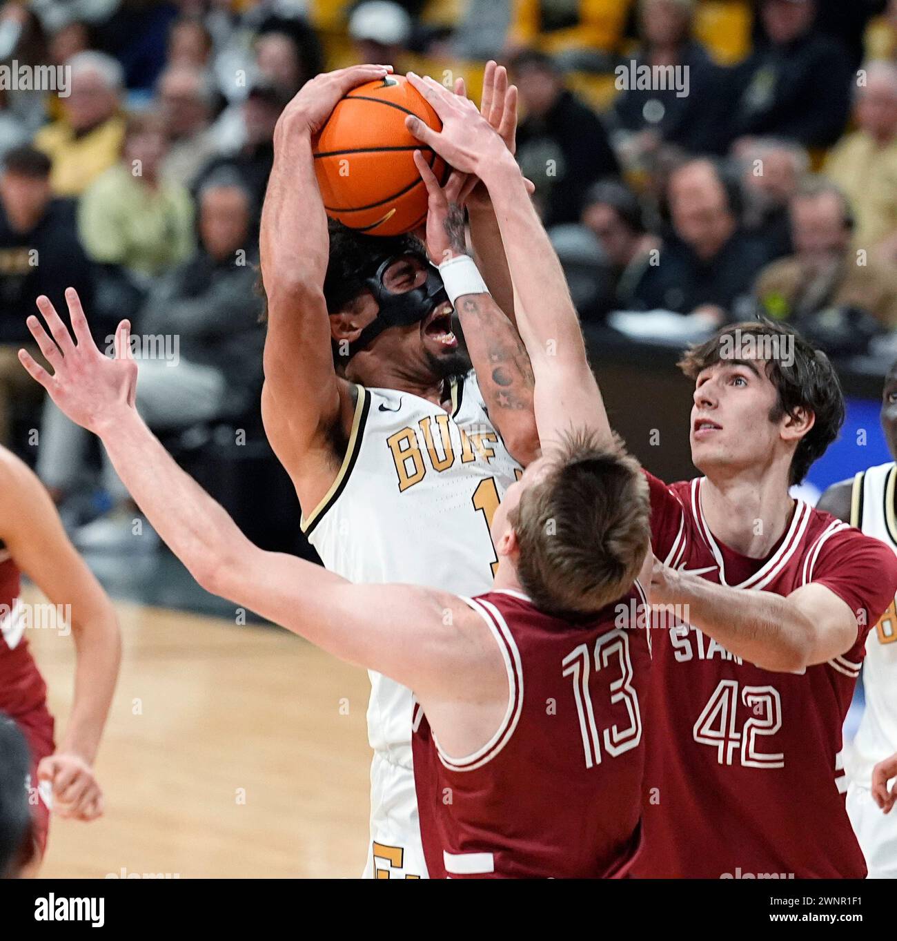 Colorado guard J'Vonne Hadley, right, has his shot blocked by Stanford ...
