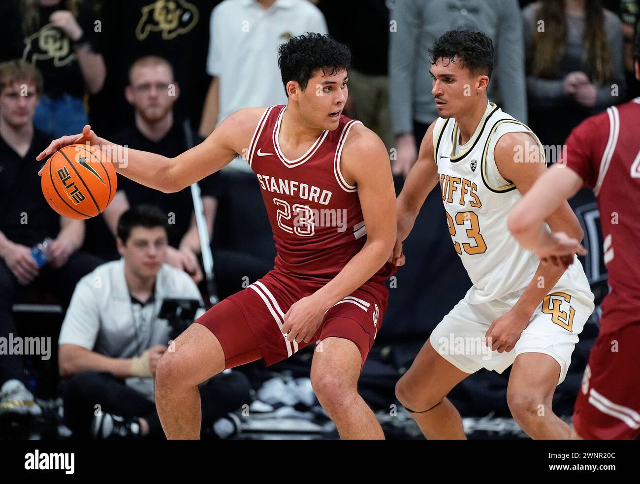 Stanford forward Brandon Angel, left, looks to pass the ball as ...