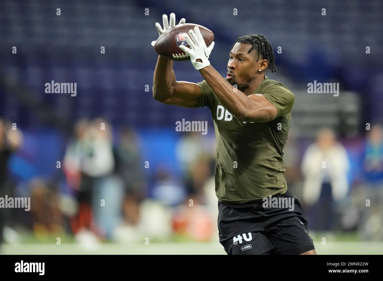 Michigan defensive back Josh Wallace runs a drill at the NFL football ...