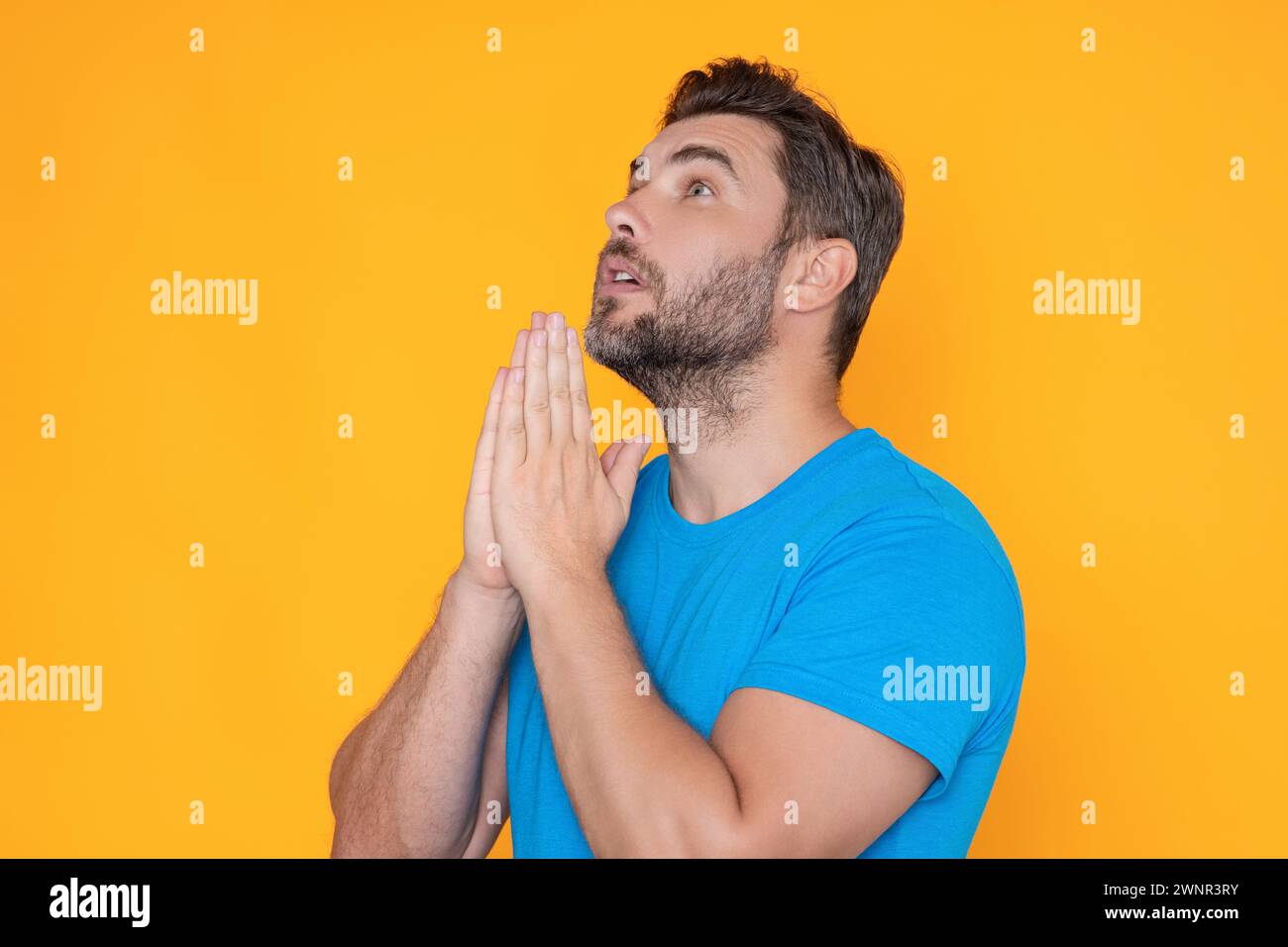 Man praying. Isolated portrait of male pray. Guy thinking intensely ...