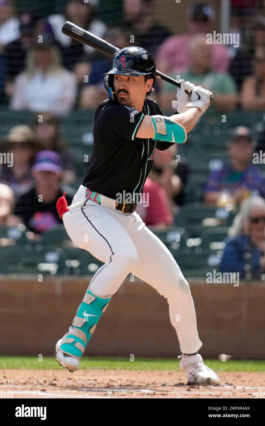 Arizona Diamondbacks' Corbin Carroll starts his swing against the Milwaukee Brewers during the ...