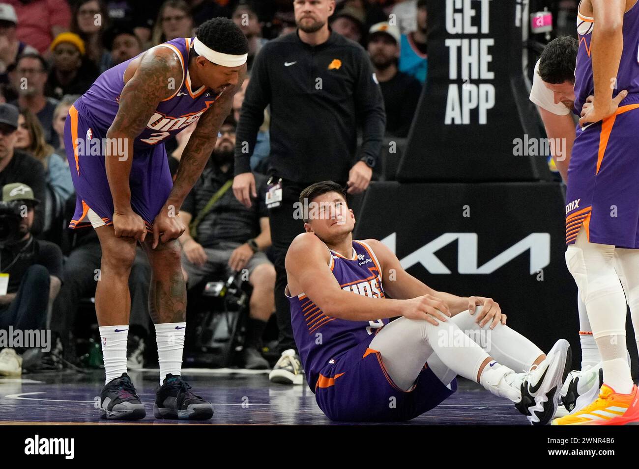 Phoenix Suns guard Grayson Allen, center, reacts to guard Bradley Beal ...