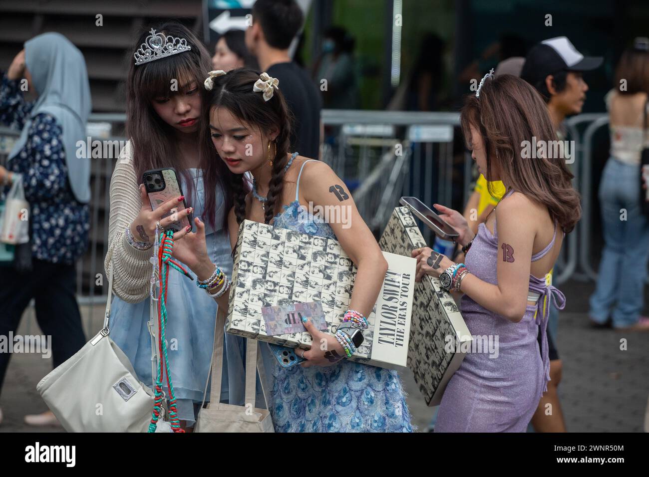 2 March 2024. Chinese asian fans holding merchandise at Taylor Swift ...