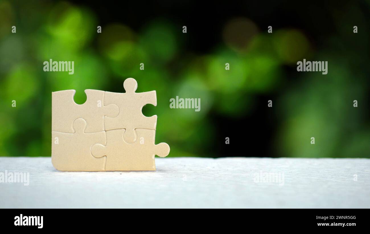 Concept puzzle pieces on natural bokeh background. Mission, success ...