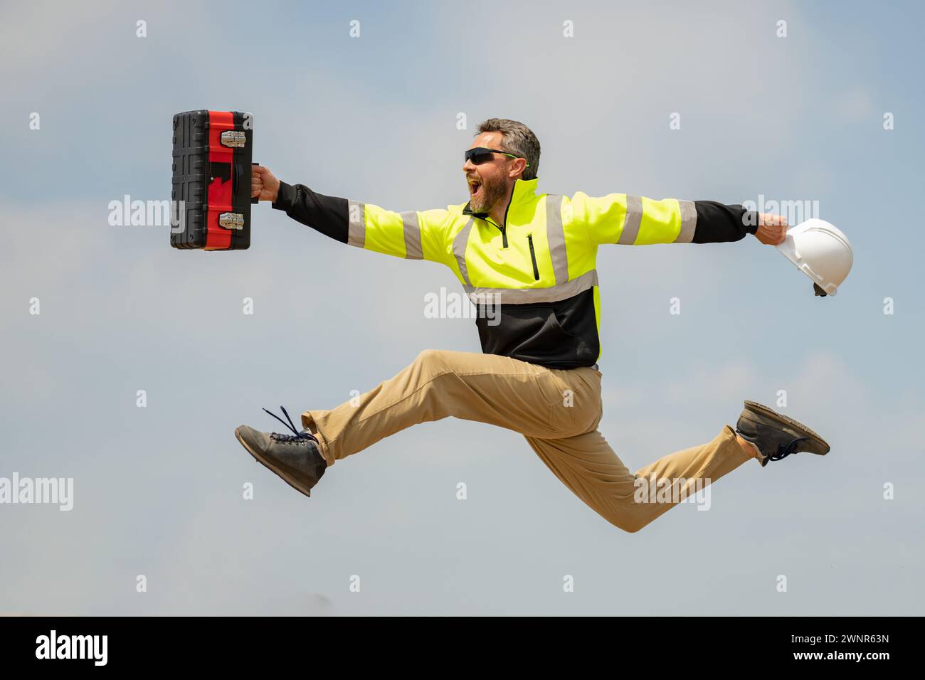 Crazy builder excited jump on site construction. Excited builder ...