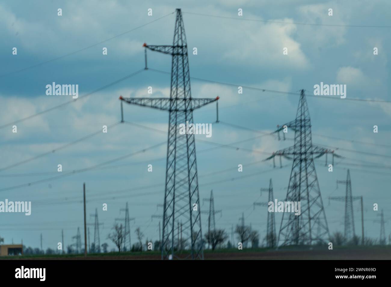 High voltage towers with sky background. Power line support with wires ...