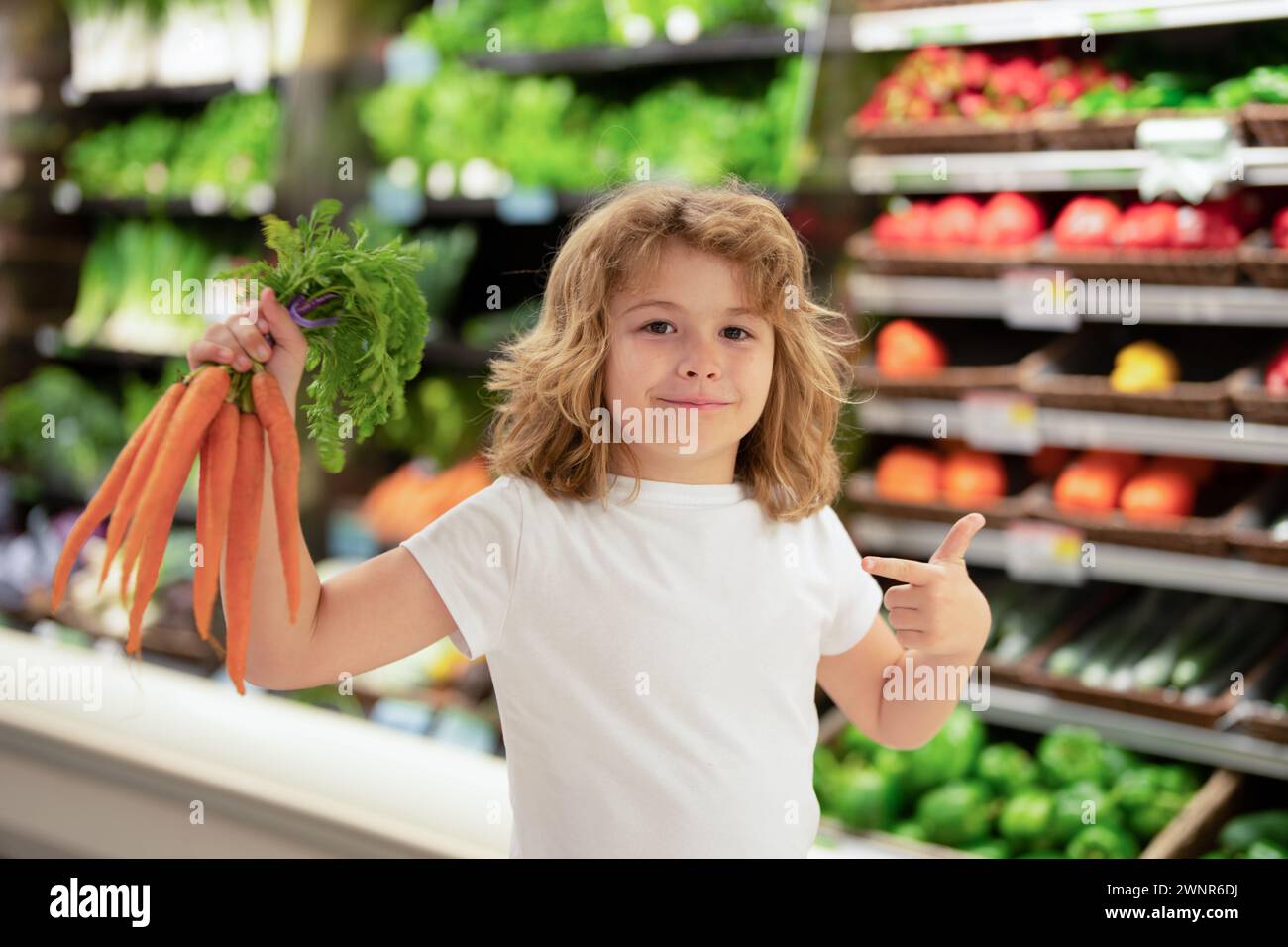 Child in food shop in food market store. Kids shopping in food shop ...