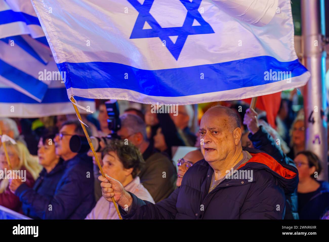 Haifa, Israel - March 02, 2024: Crowd of people with various signs and ...