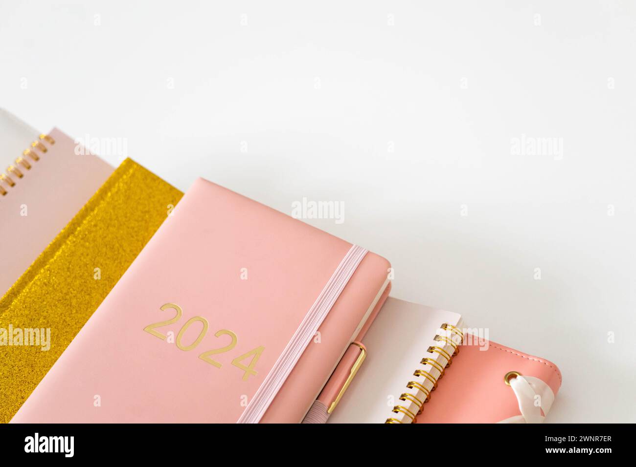 Pink coral colored diary for the year 2024 and many other diaries, pen ...